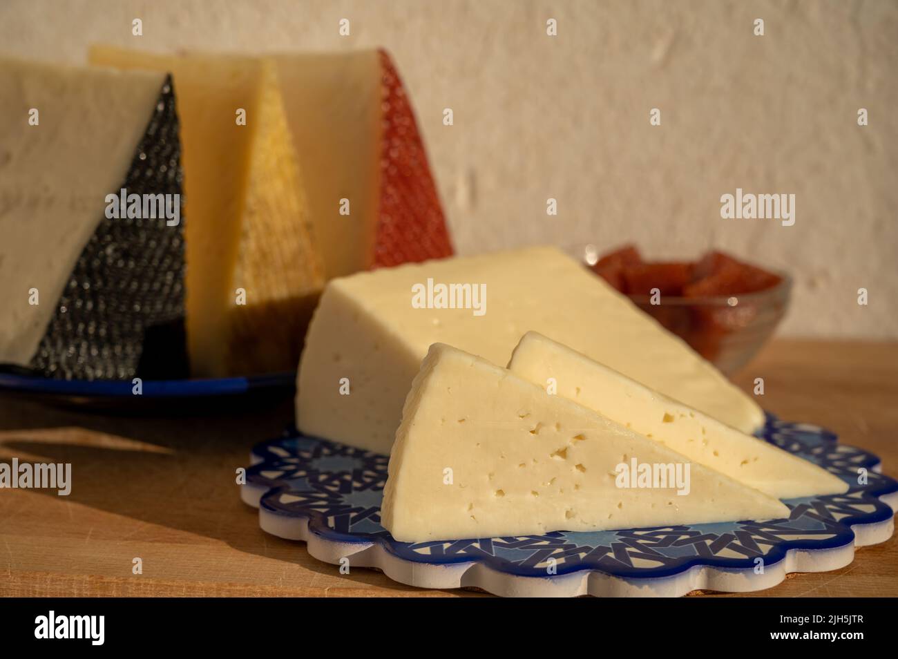Spanish hard manchego, cow, sheep and goat cheeses served outdoor with ...