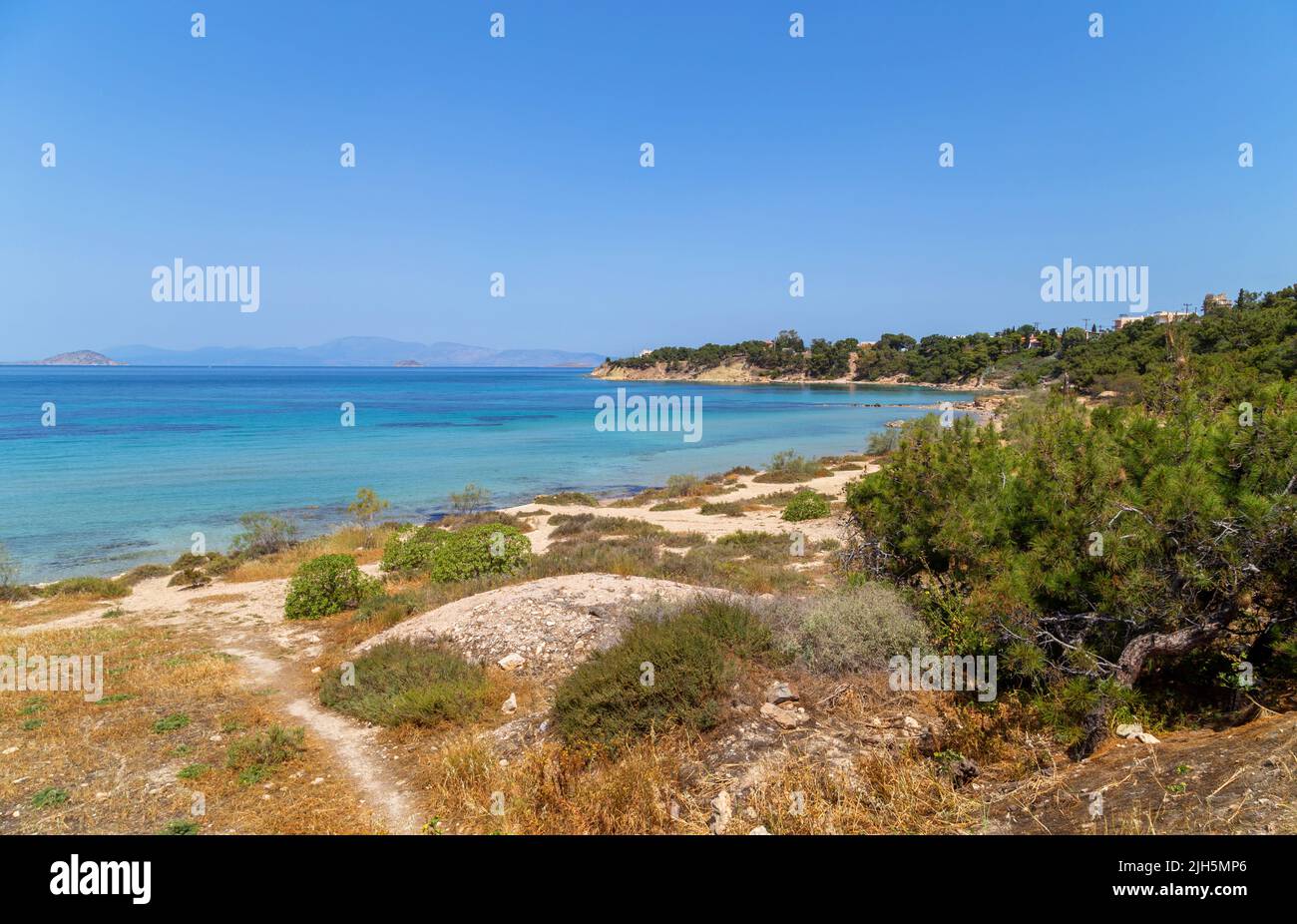 The coast of Aegina island with clear and blue waters of Mediterranean ...