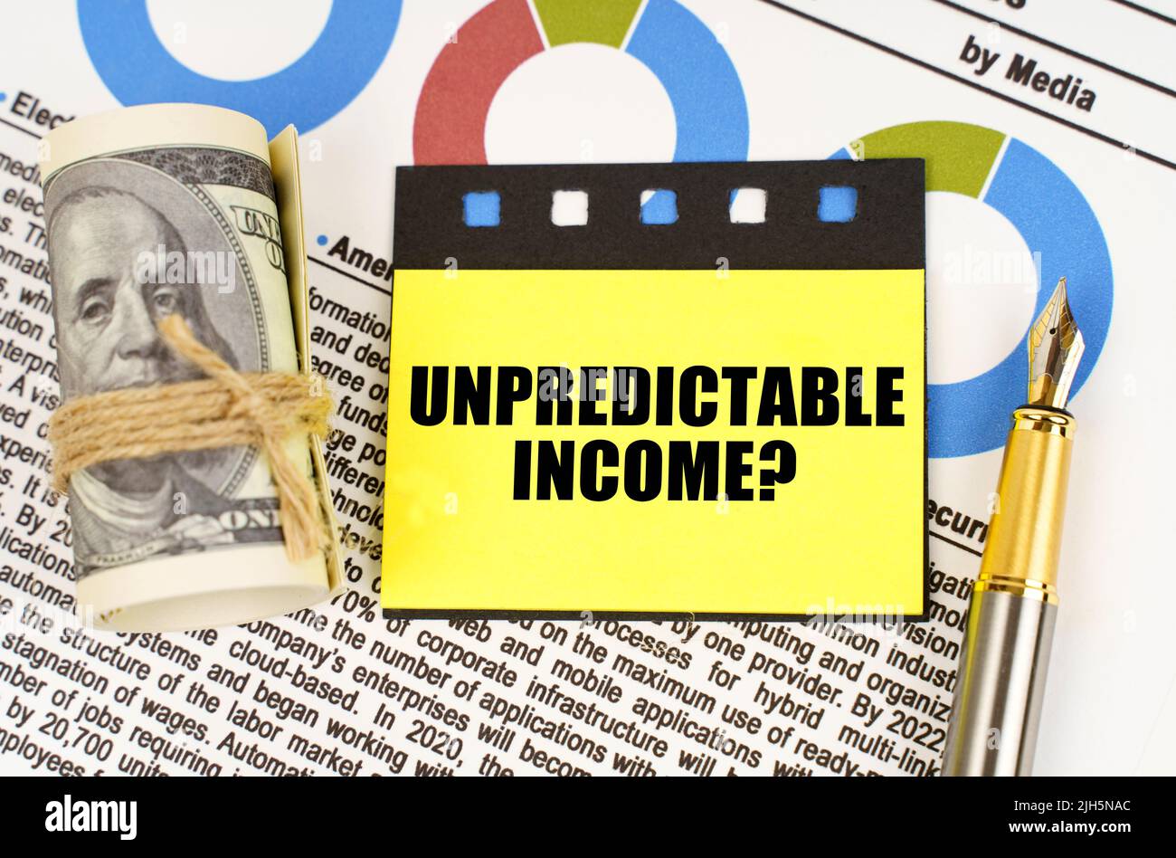 Business concept. On documents with diagrams there are dollars, a pen ...