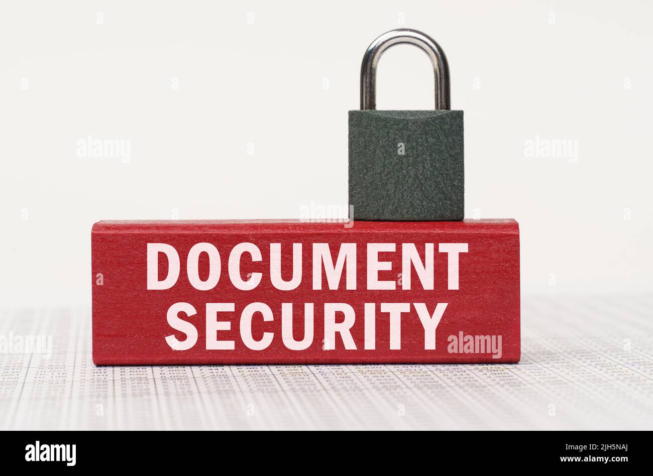 Business and security concept. On the reports there is a red block with ...