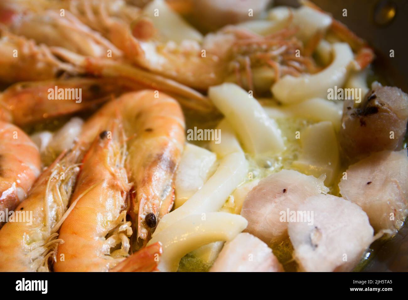 Detail of some shellfish (prawns, fish, cuttlefish) that are starting ...