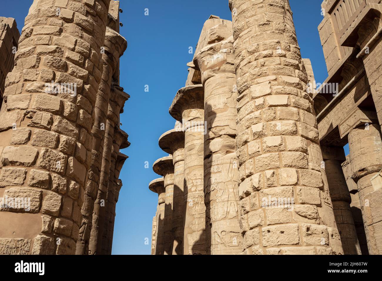 Different hieroglyphs on the walls and columns in the Karnak temple. Karnak temple is the ...