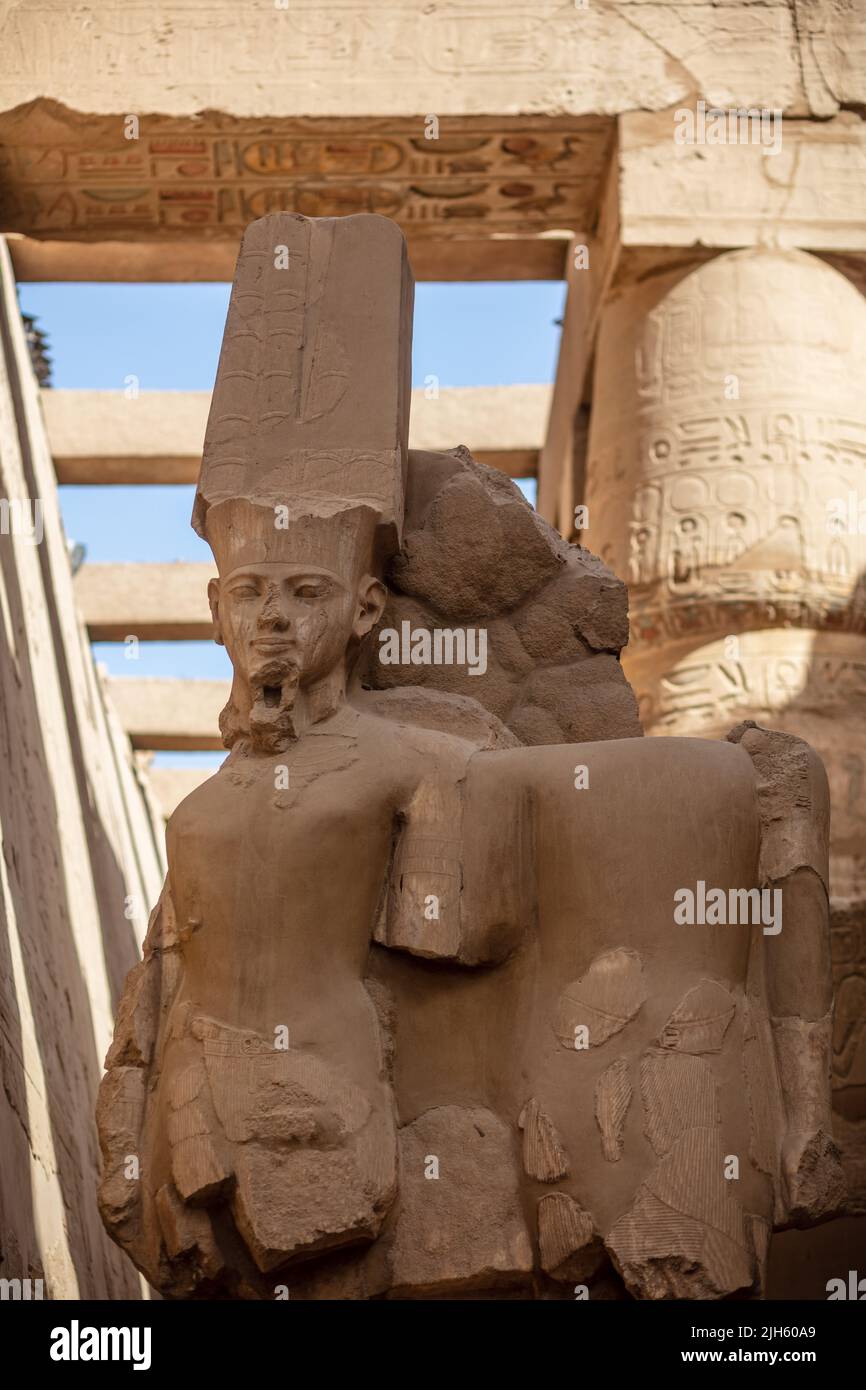 Statues of ancient Egyptian pharaohs and gods. Various hieroglyphs on ...