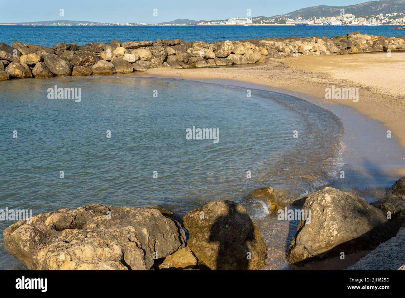 Promenade of the Mallorcan town of Es Molinar at sunrise Stock Photo ...