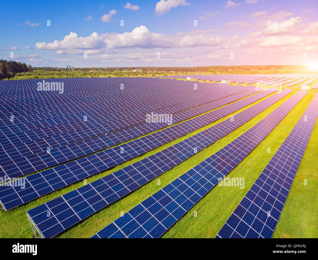 aerial view of solar panels on a sunny day. power farm producing clean ...