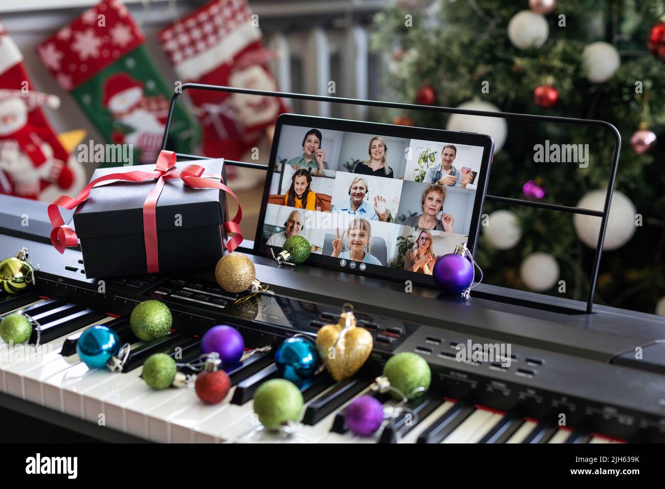 Black and white piano keys and tablet screen. The concept of online ...