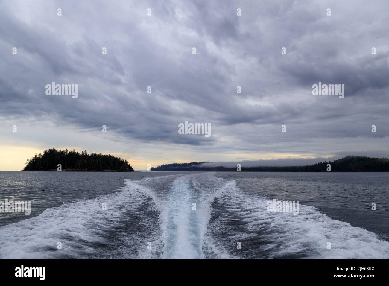 An outboard motor wake from a cruising powerboat on the sea in a ...