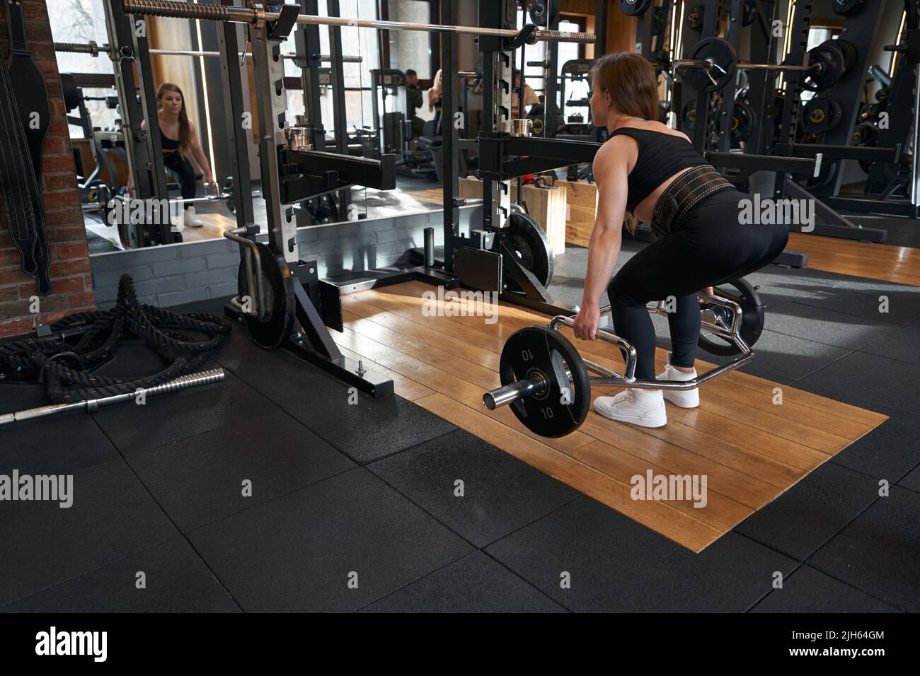 Professional weightlifter doing deadlift exercise at gym Stock Photo ...
