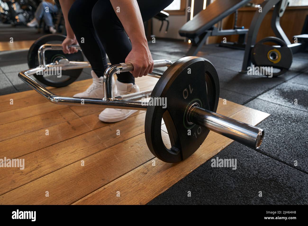 Female bodybuilder doing exercise with plate-loaded trap-bar Stock ...