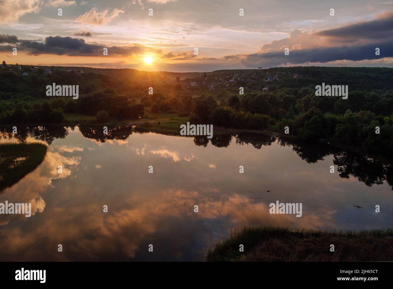 Sunset above the river in natural rural landscape Stock Photo - Alamy