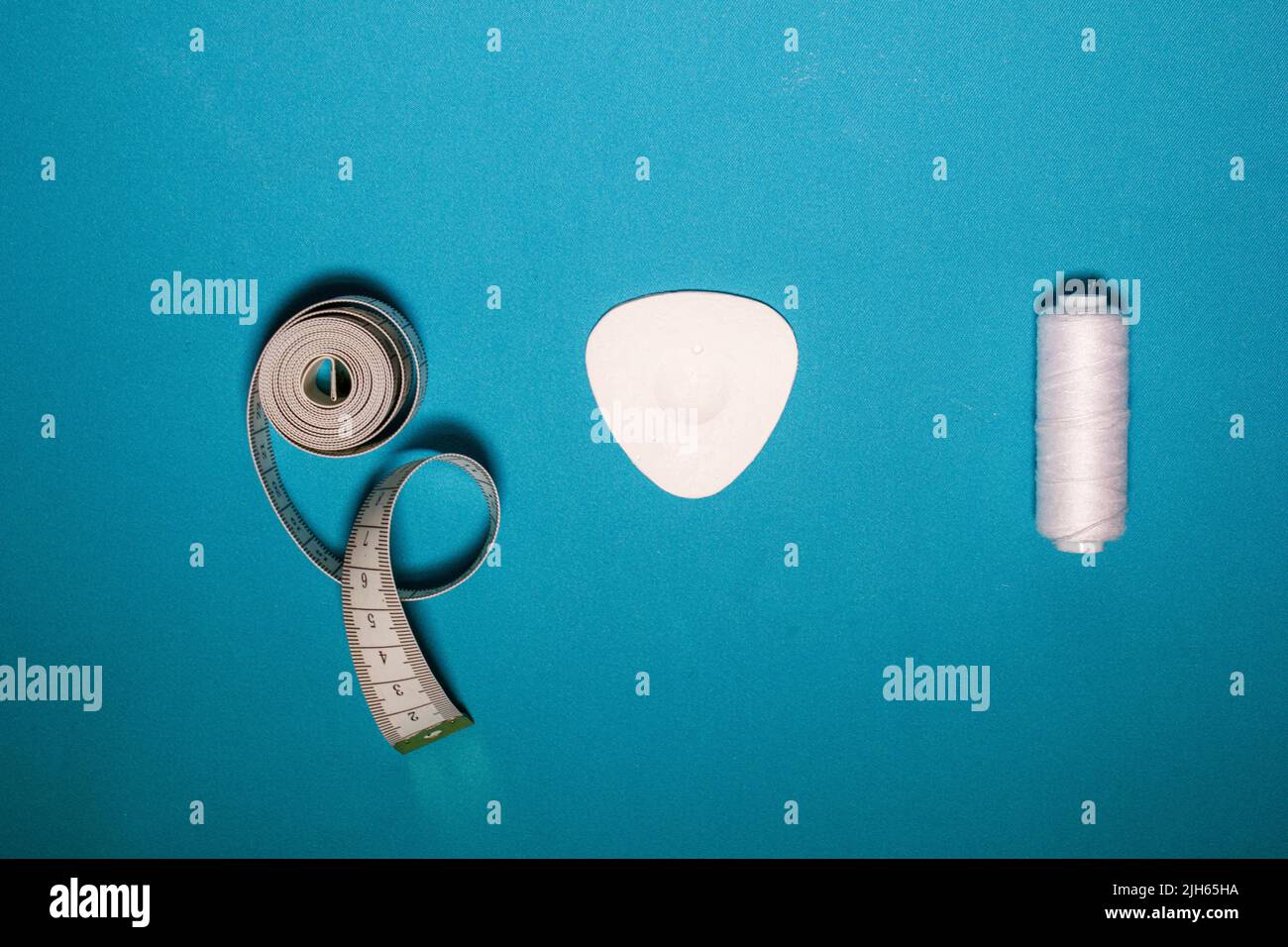 Blue textured background with sewing tools, copy space on background ...