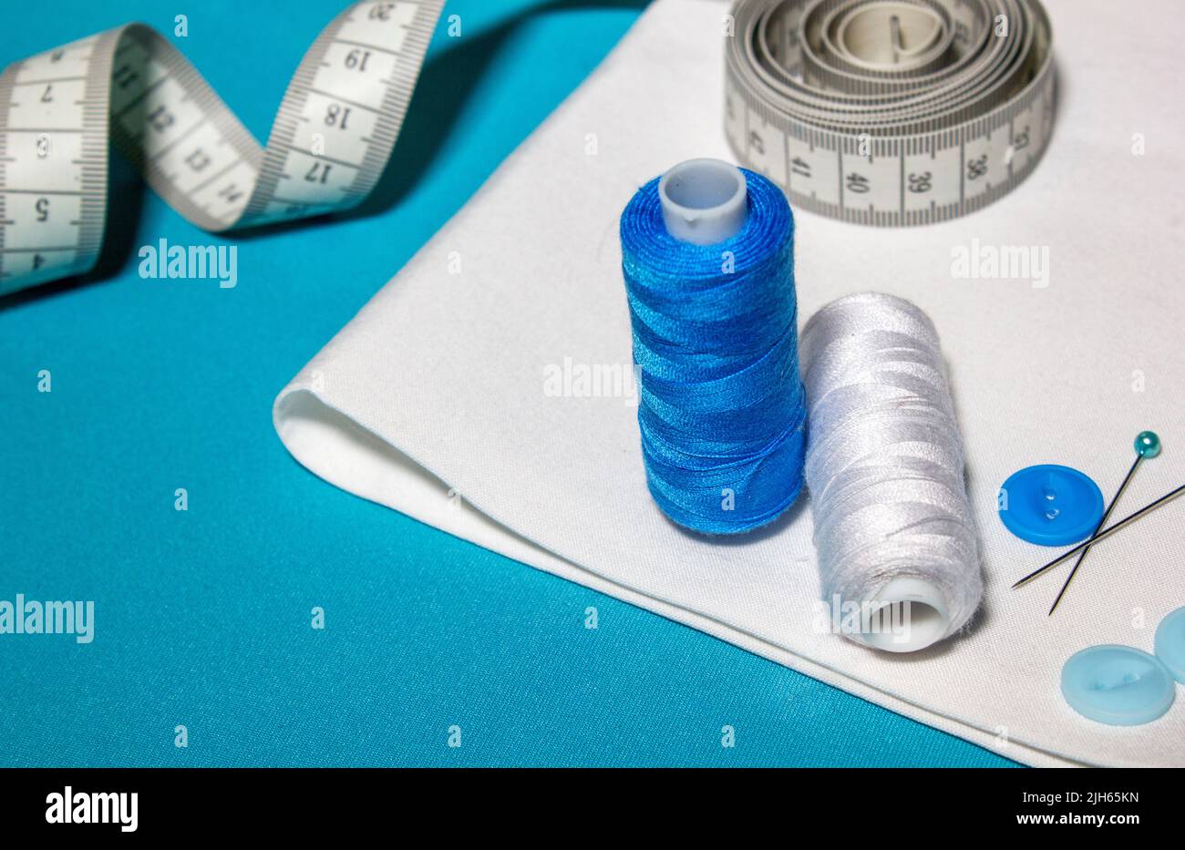 Blue textured background with sewing tools, copy space on background ...