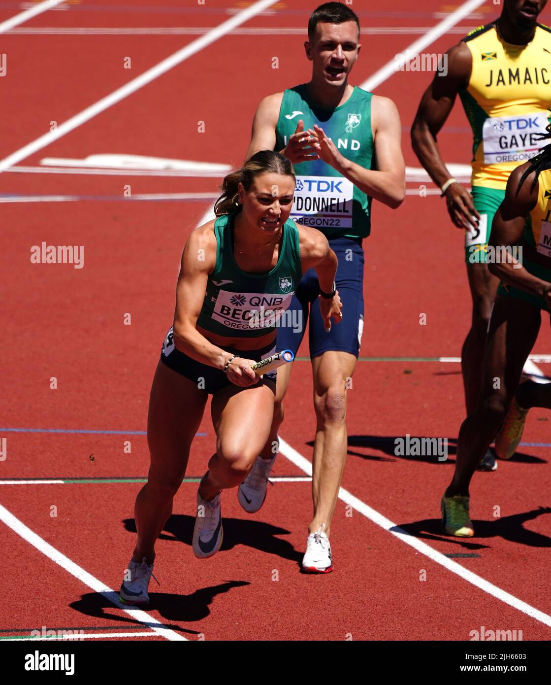 Ireland's Sophie Becker (left) receives the baton from Christopher O ...