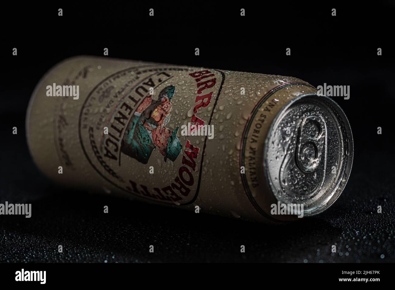 Birra Moretti, a premium lager beer with water droplets on black ...
