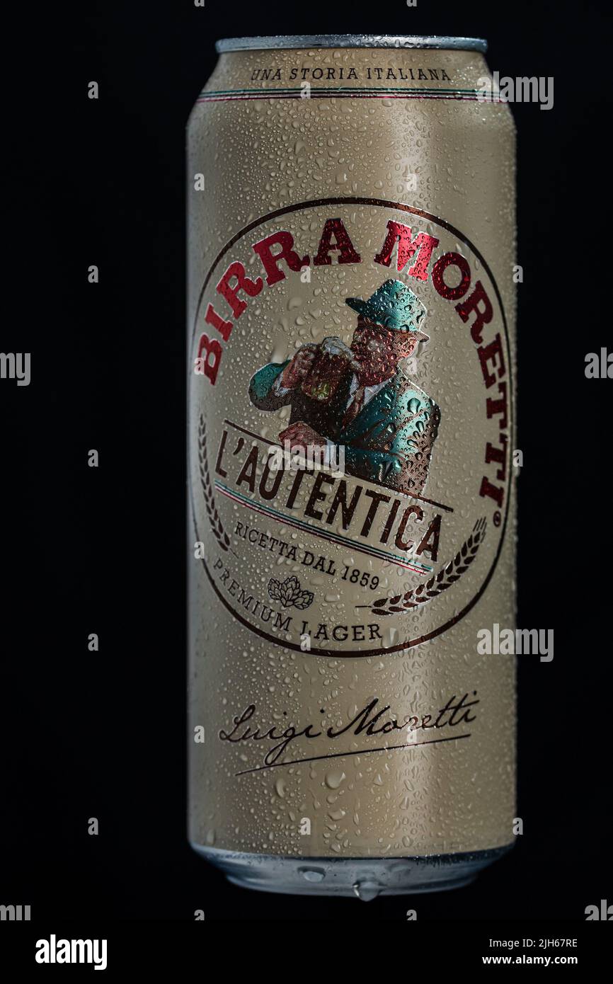 Birra Moretti, a premium lager beer with water droplets on black ...