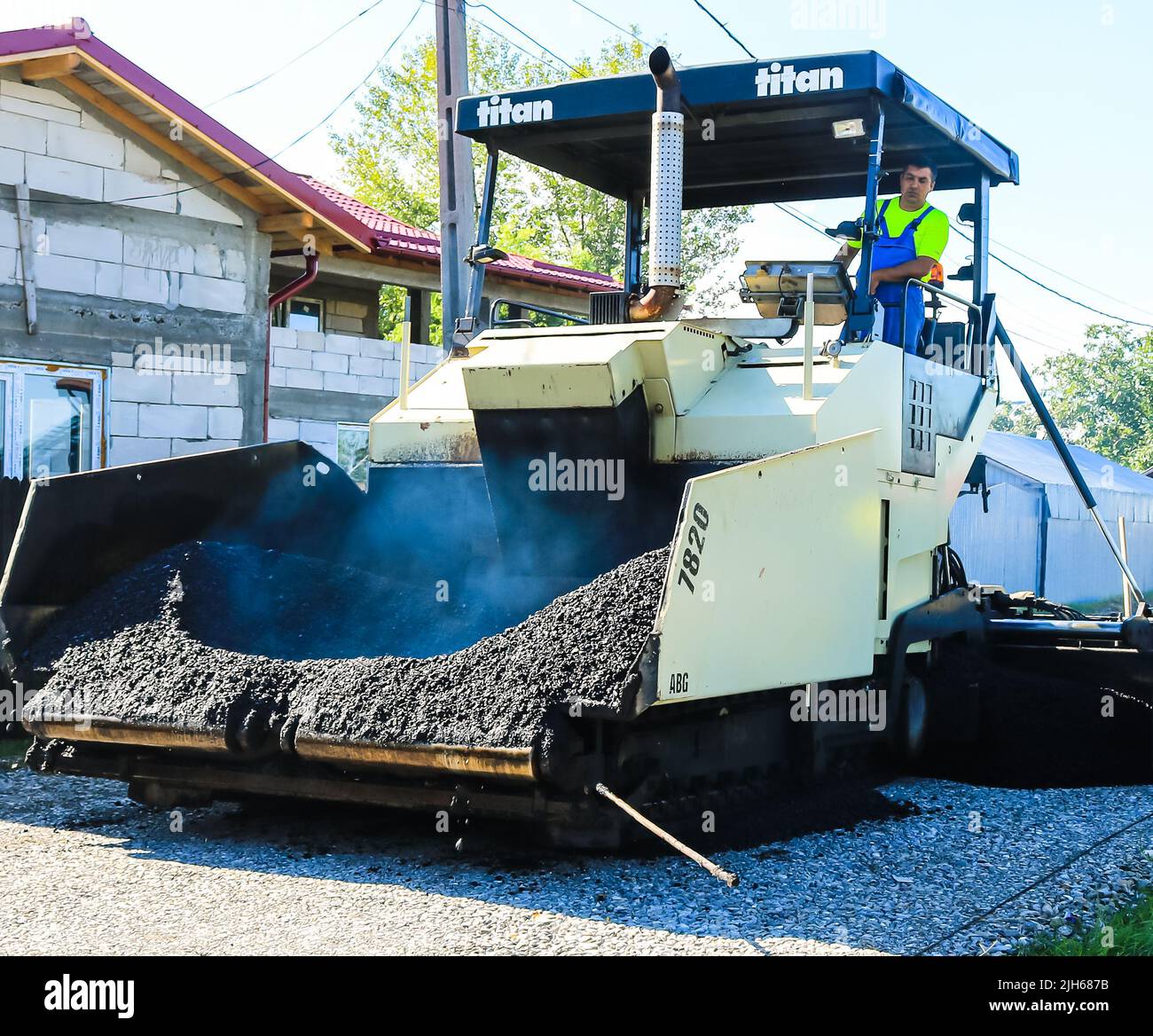 Workers and asphalting machines. Construction, asphalting of new road ...