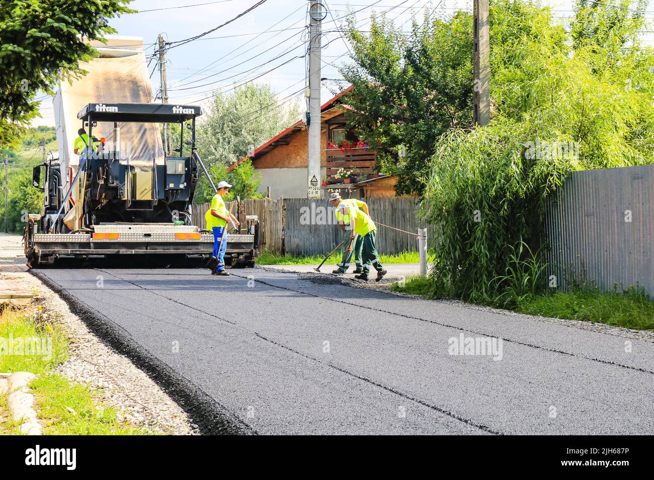 Workers and asphalting machines. Construction, asphalting of new road ...