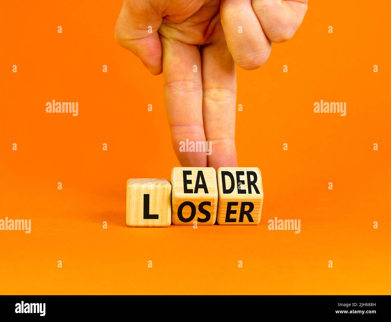 Loser or leader symbol. Concept words Loser or leader on wooden cubes ...