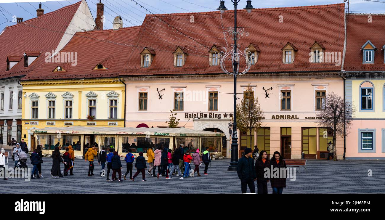 People and tourists wandering in old town Sibiu, Romania, 2022 Stock ...