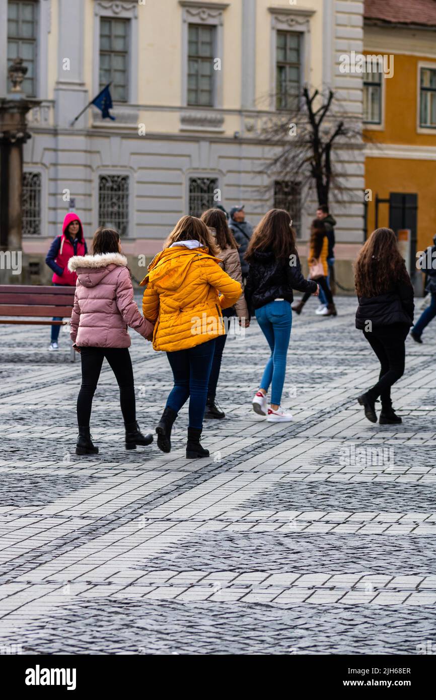 People and tourists wandering in old town Sibiu, Romania, 2022 Stock ...