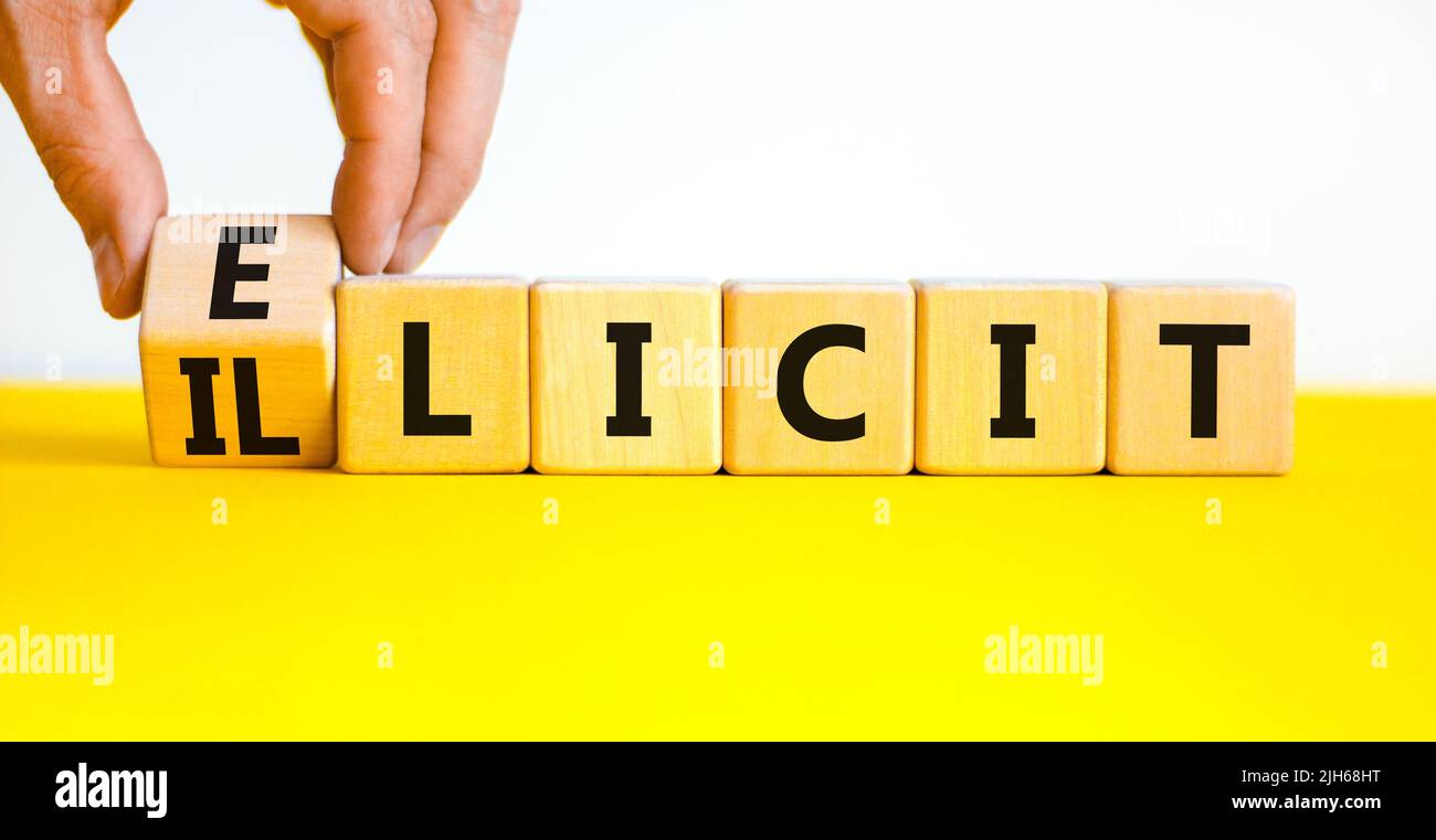 Illicit or elicit symbol. Businessman turns wooden cubes and changes ...