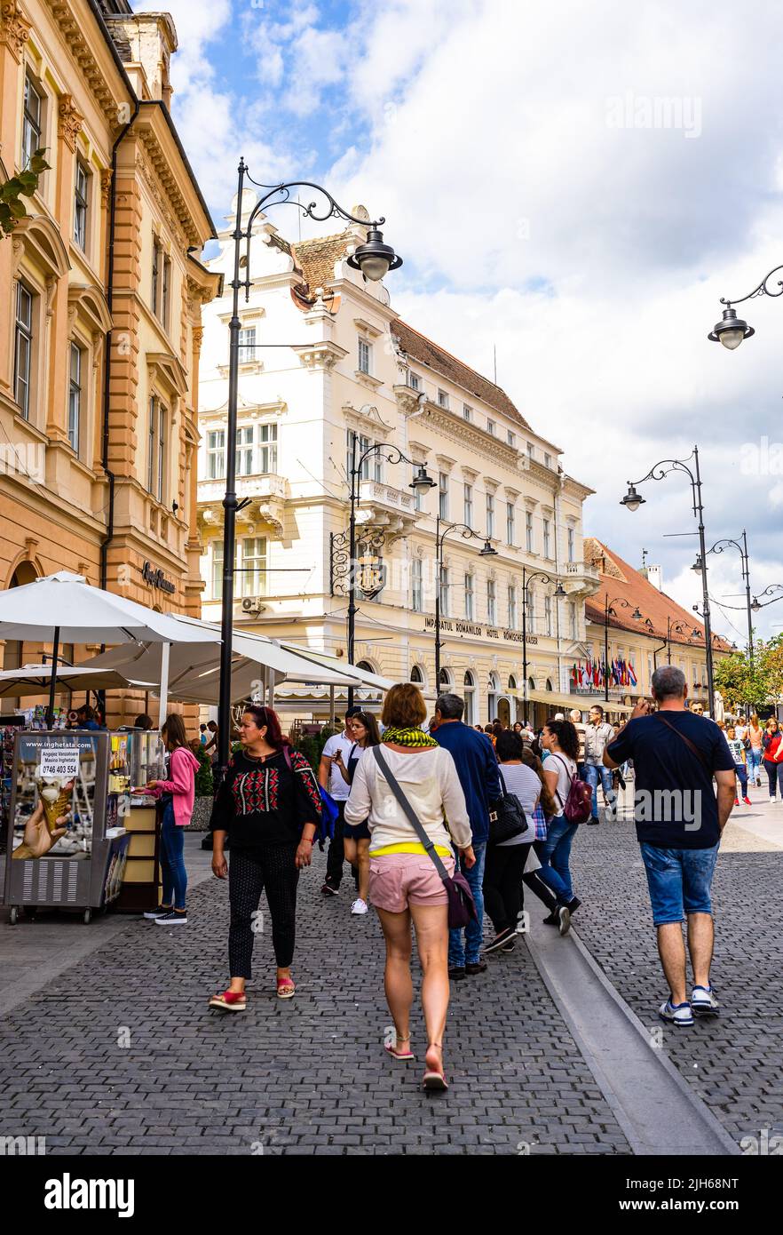 People and tourists wandering in old town Sibiu, Romania, 2022 Stock ...