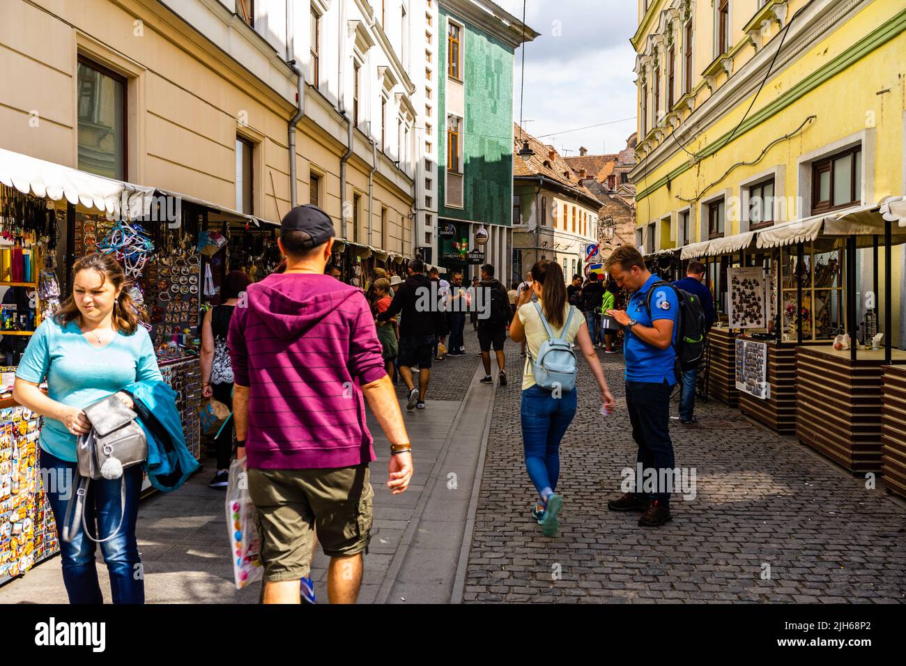 People and tourists wandering in old town Sibiu, Romania, 2022 Stock ...