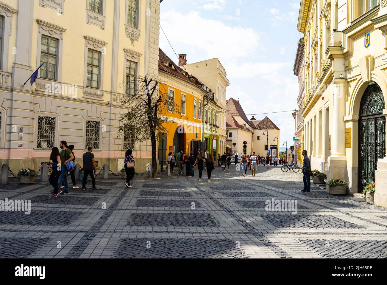 People and tourists wandering in old town Sibiu, Romania, 2022 Stock ...