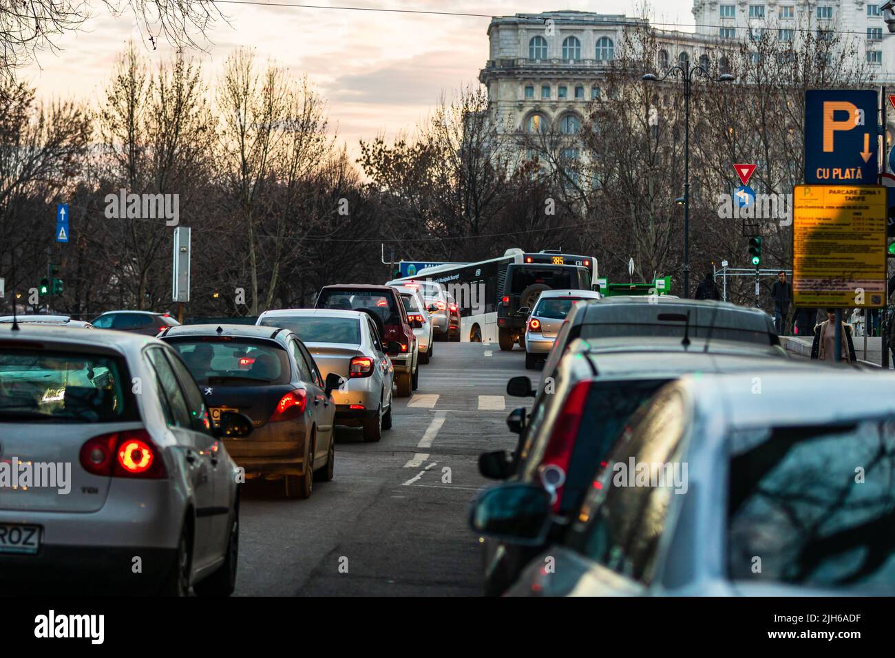 Car traffic at rush hour in downtown area of the city. Car pollution ...