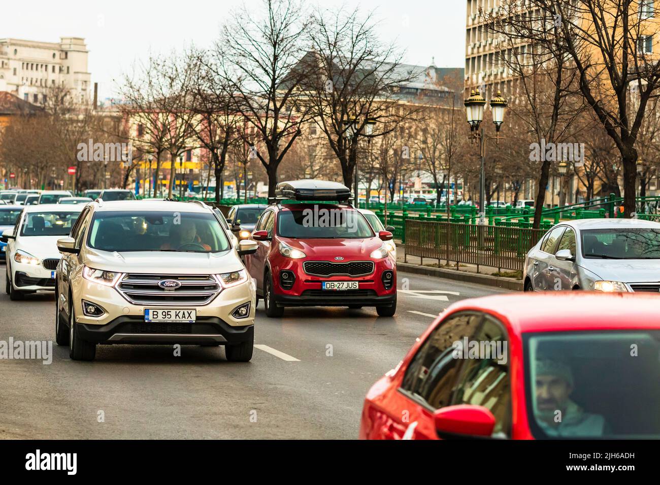 Car traffic at rush hour in downtown area of the city. Car pollution ...