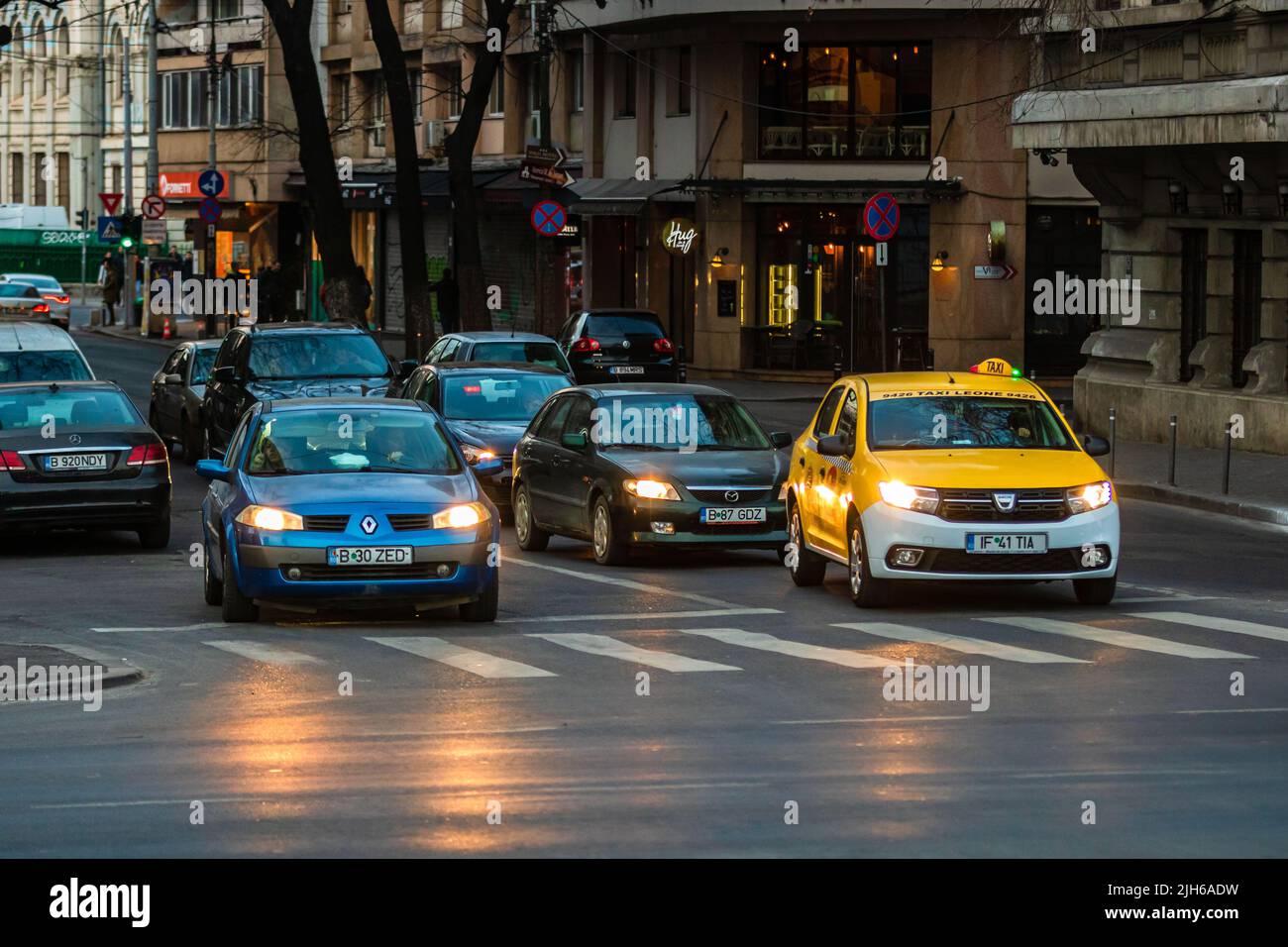 Car traffic at rush hour in downtown area of the city. Car pollution ...