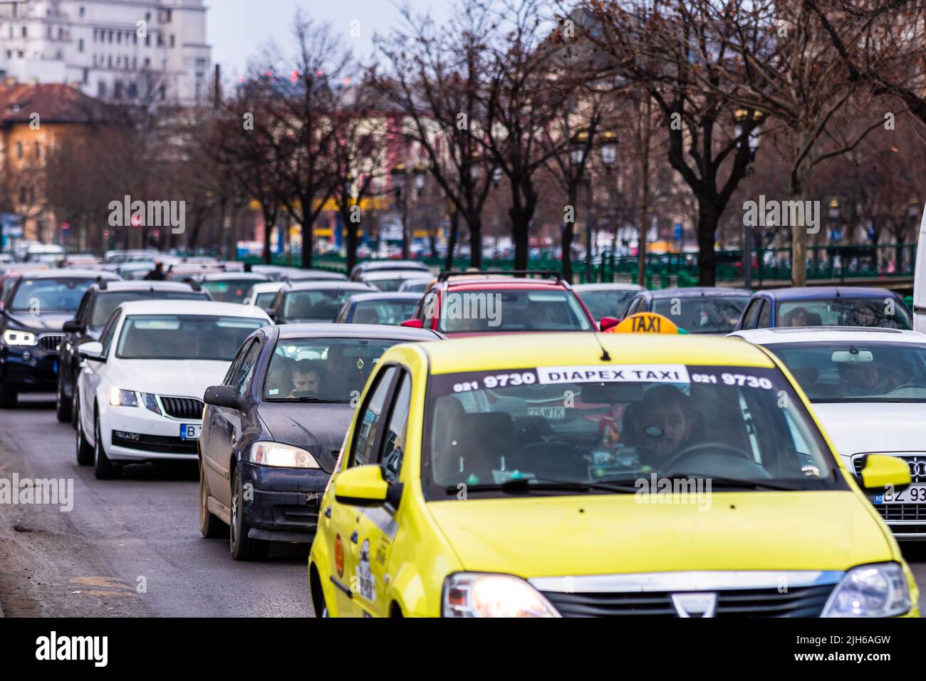 Car traffic at rush hour in downtown area of the city. Car pollution ...