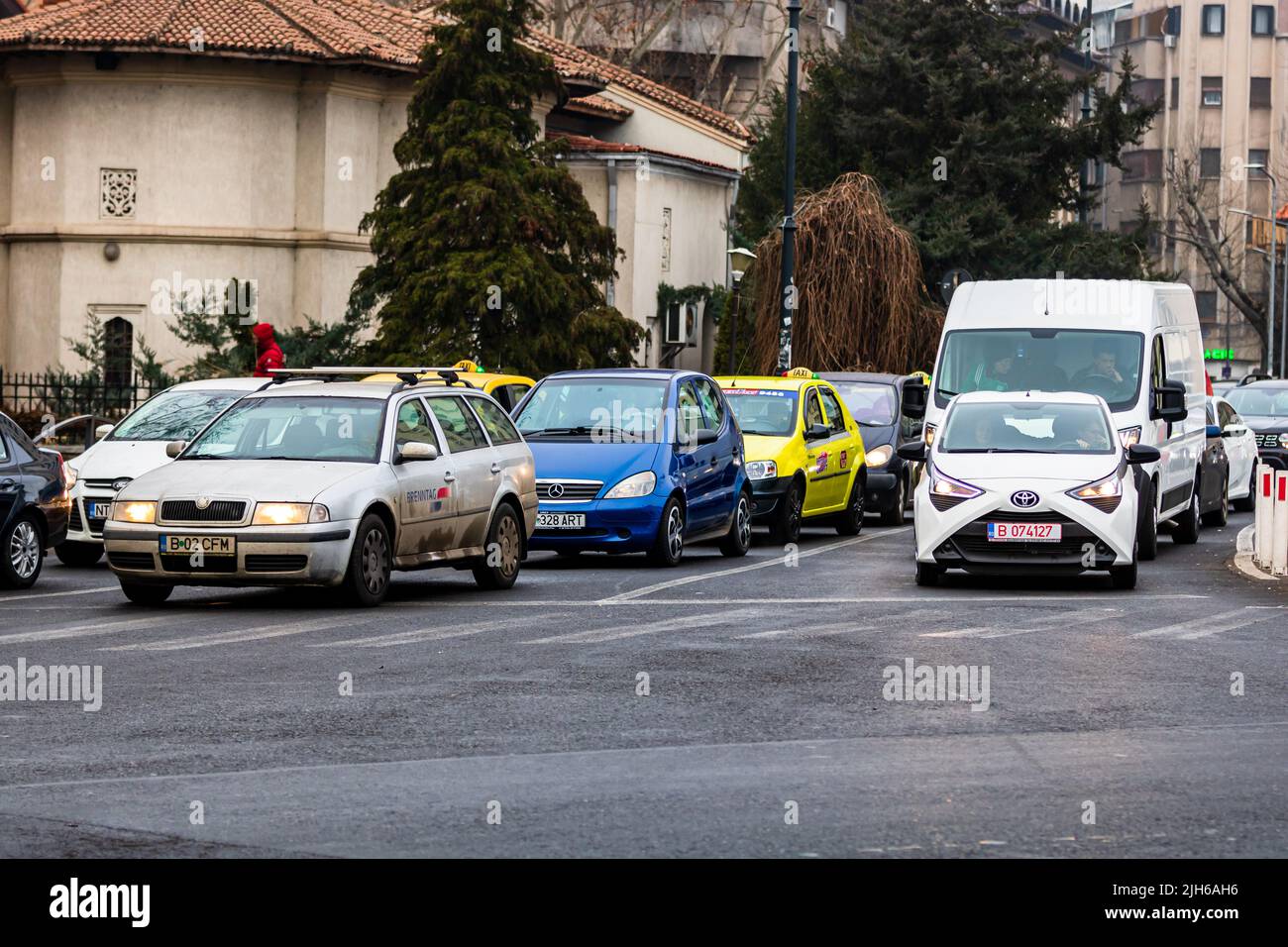 Car traffic at rush hour in downtown area of the city. Car pollution ...
