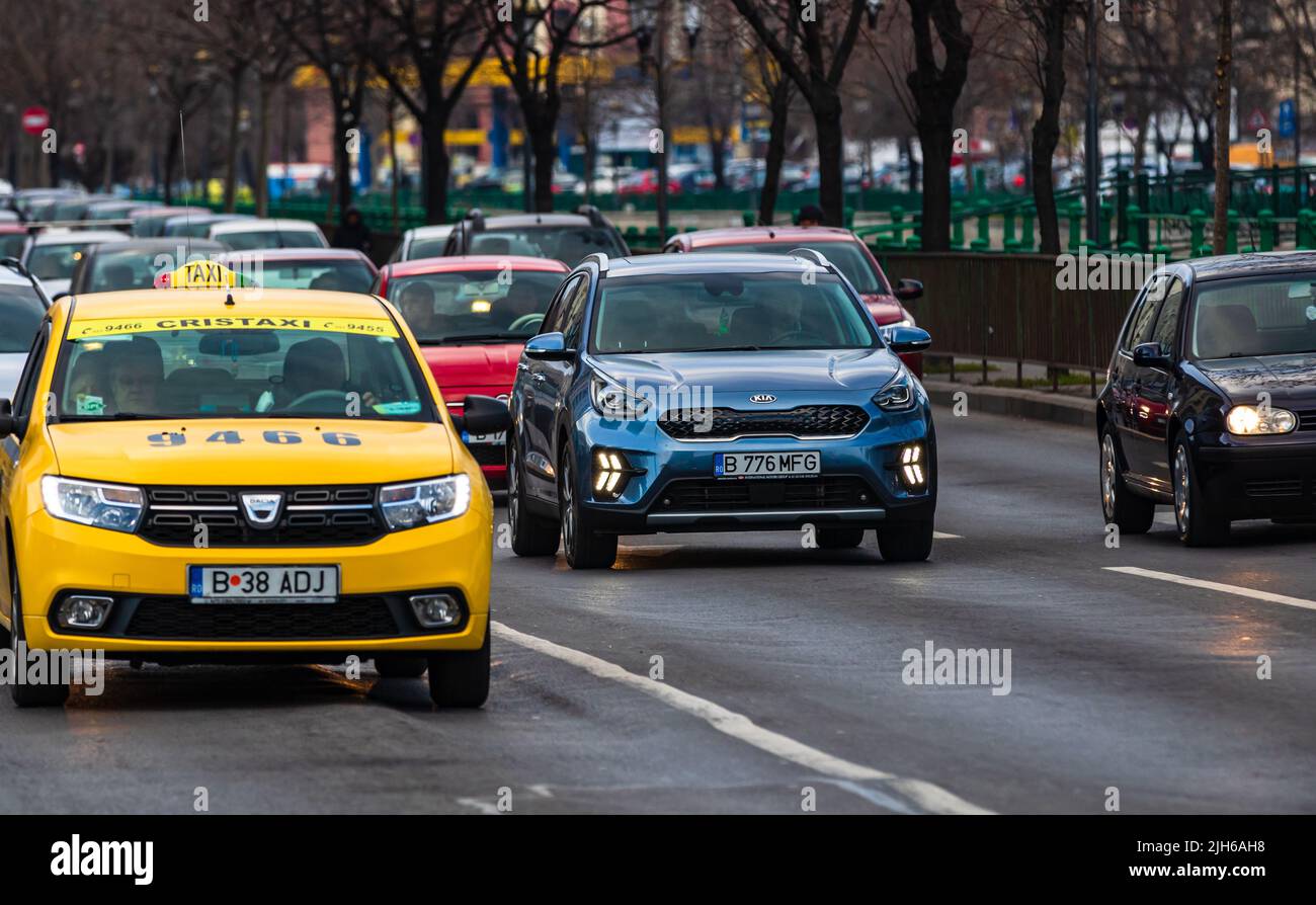 Car traffic at rush hour in downtown area of the city. Car pollution ...