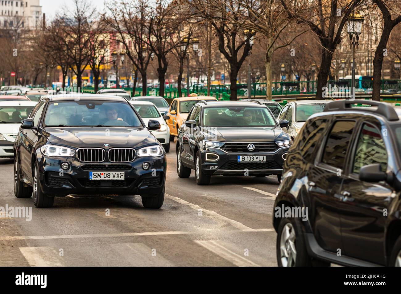 Car traffic at rush hour in downtown area of the city. Car pollution ...