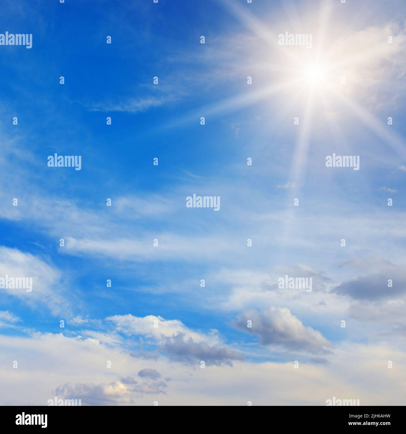 Bright sun and white clouds in sky Stock Photo - Alamy