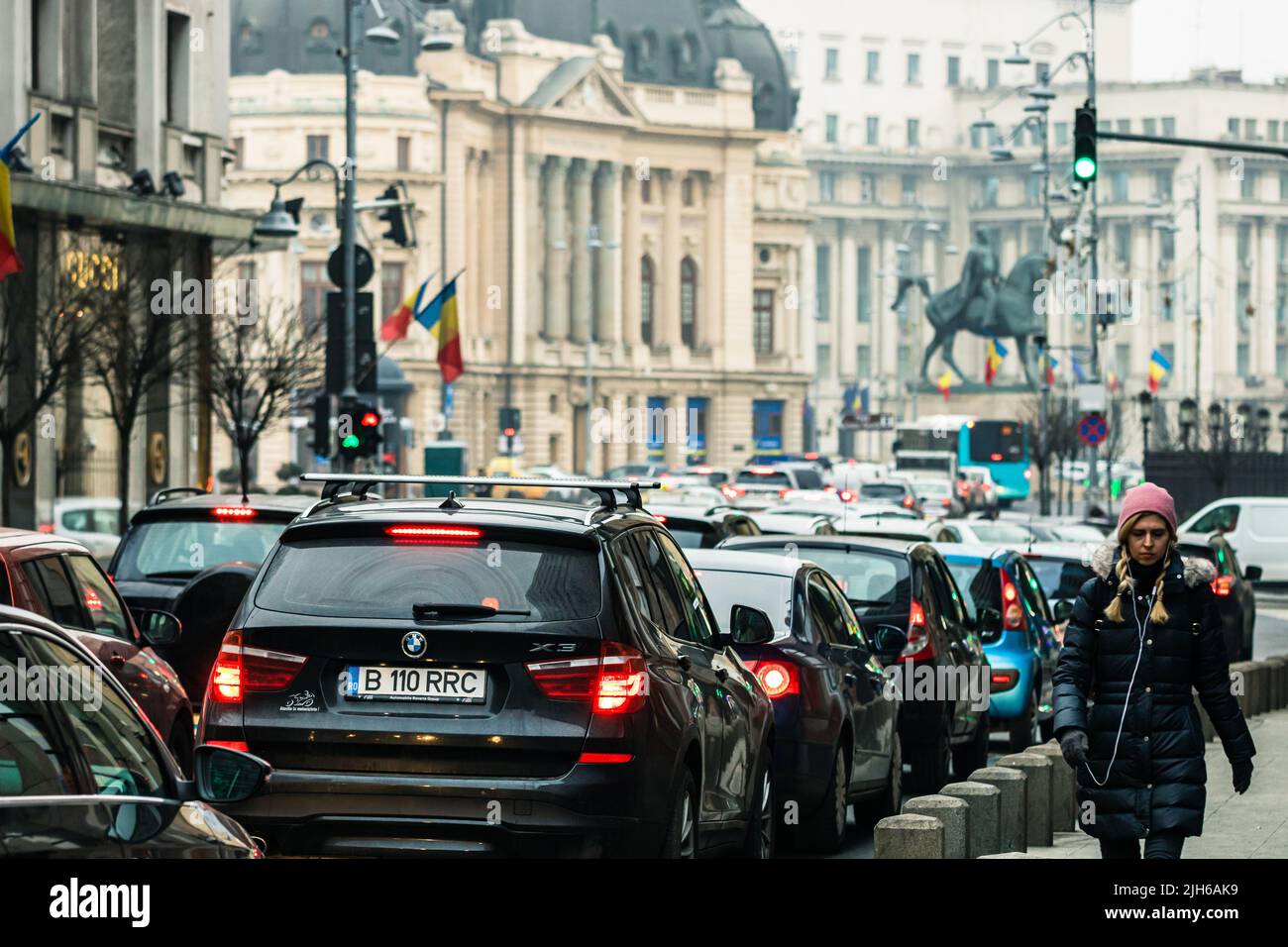 Car traffic at rush hour in downtown area of the city. Car pollution, traffic jam in the morning ...