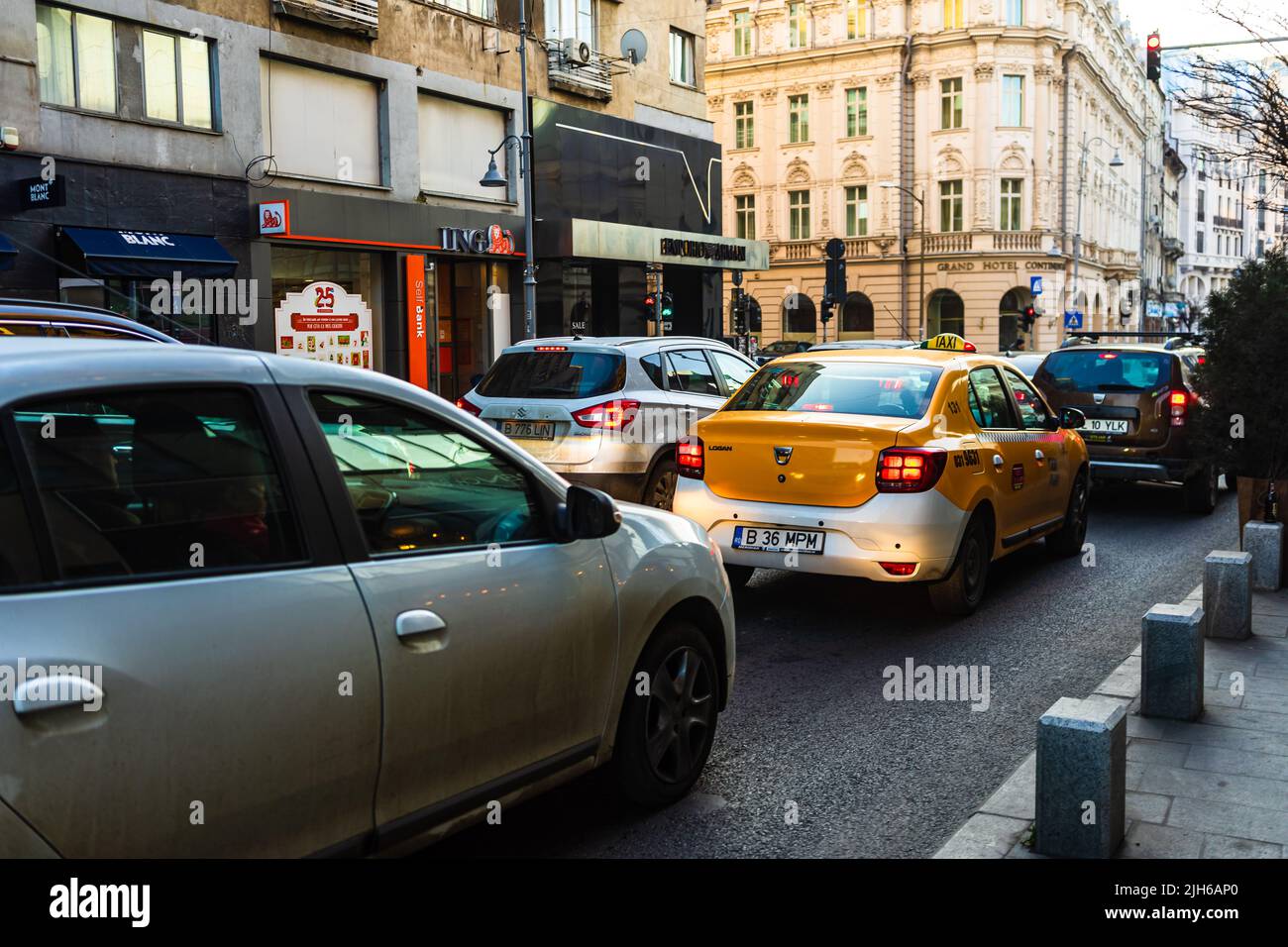 Car traffic at rush hour in downtown area of the city. Car pollution ...
