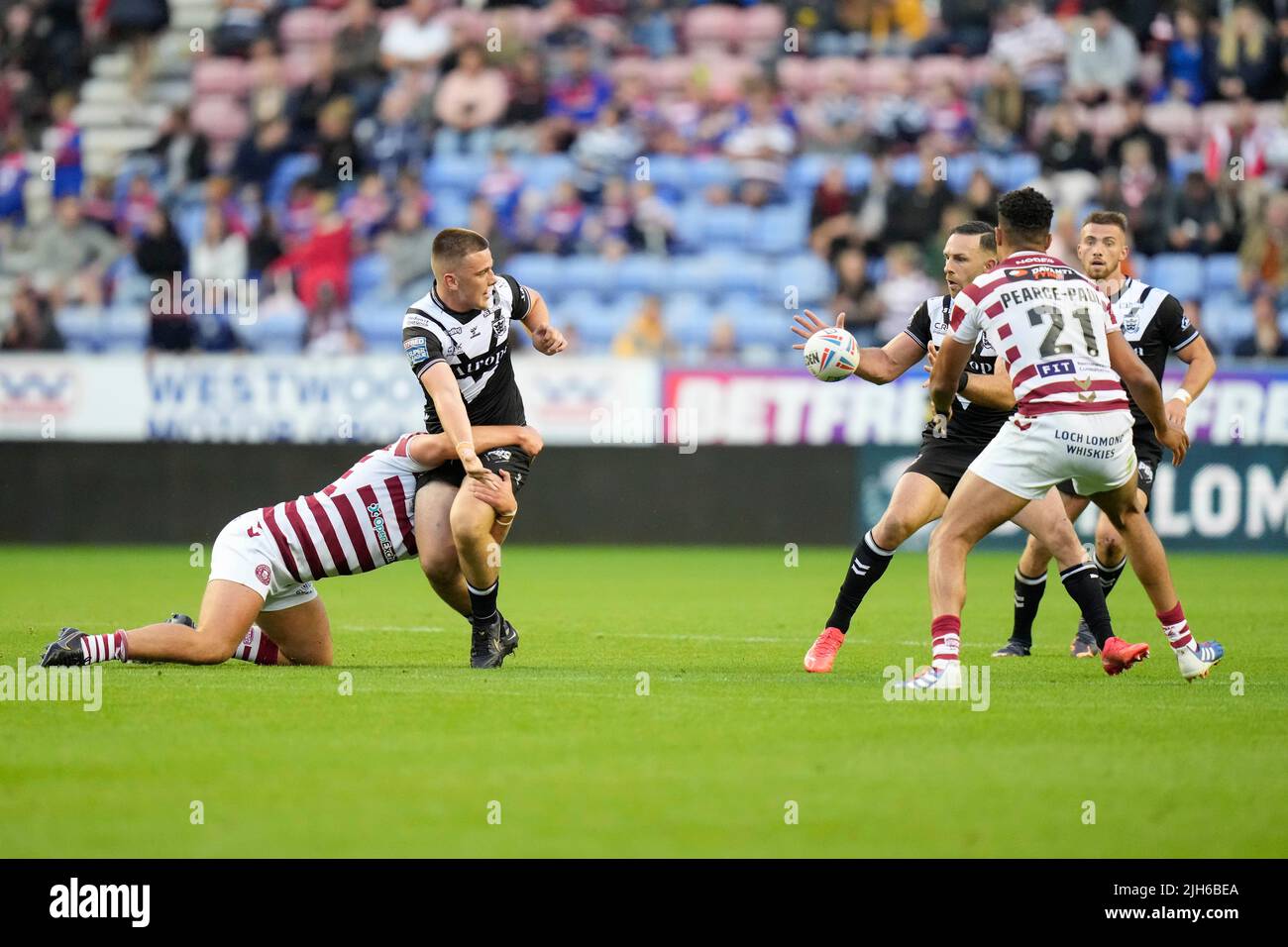 Jacob Hookem #27 of Hull FC offloads to Luke Gale #7 Stock Photo - Alamy