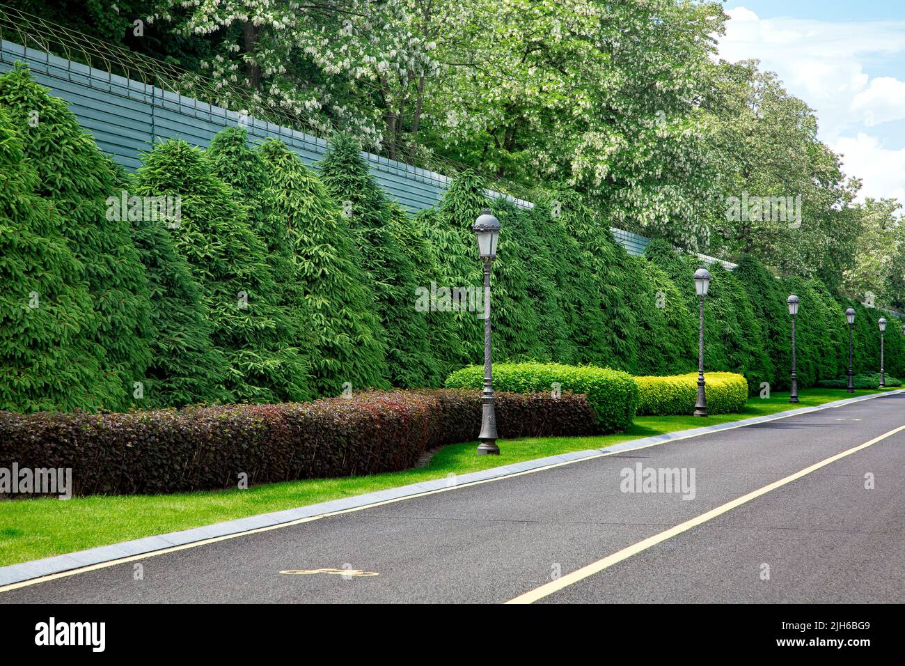 roadside of asphalt bike path with drainage concrete canal and ditch ...