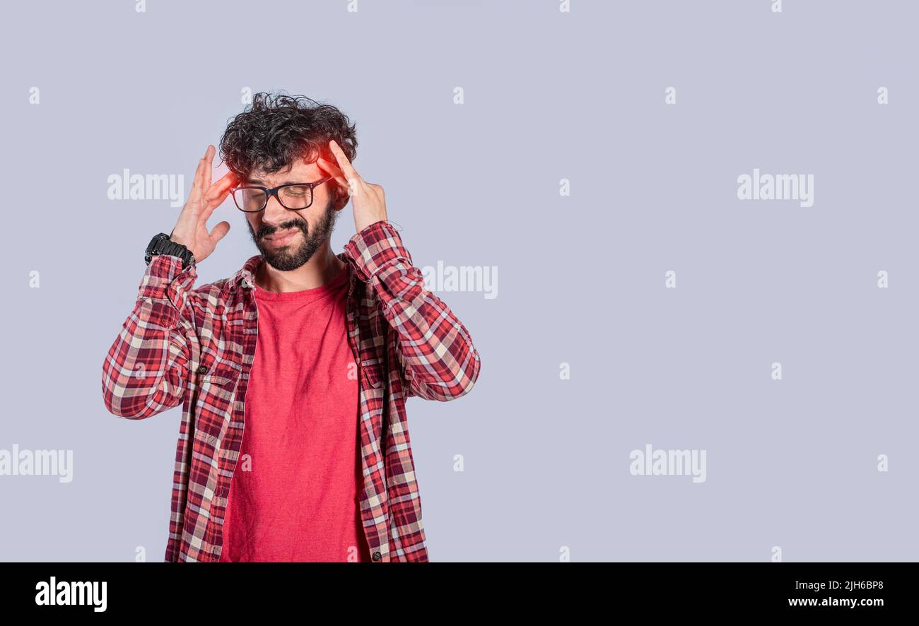 People suffering rubbing his head isolated, A young person with a ...