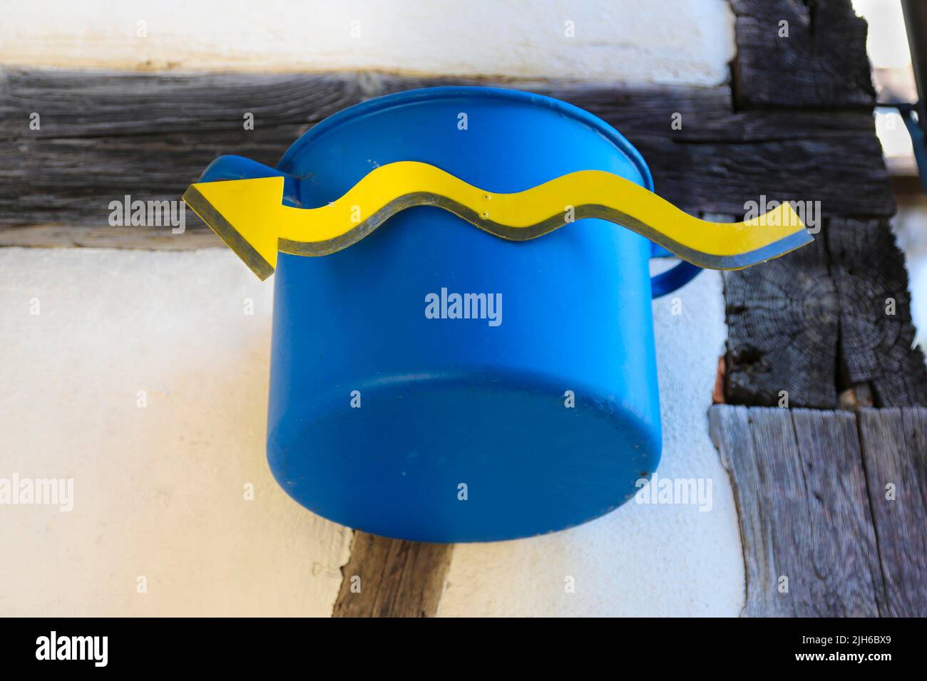 Funny, original signpost to the Blautopf, blue pot, bucket with yellow ...