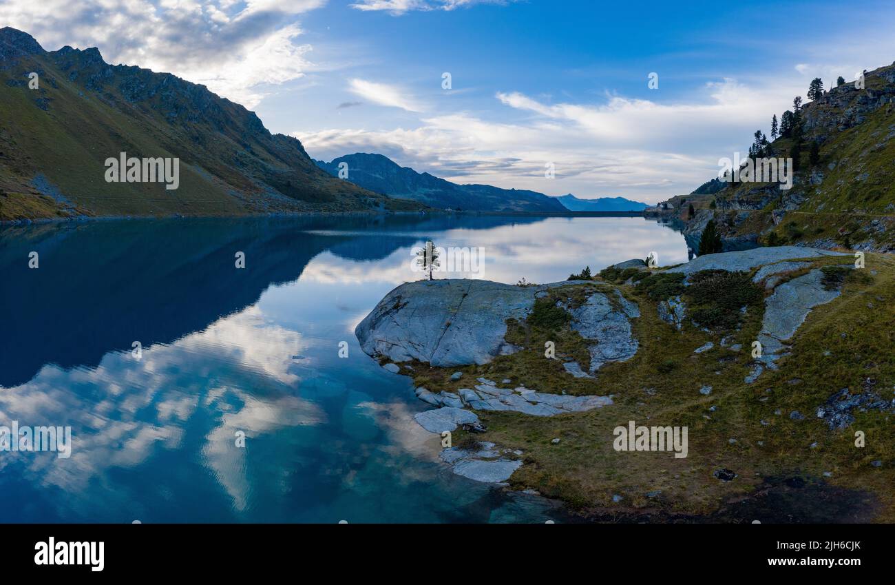 Aerial view of a rock with tree in Lac de Cleuson in the canton of ...