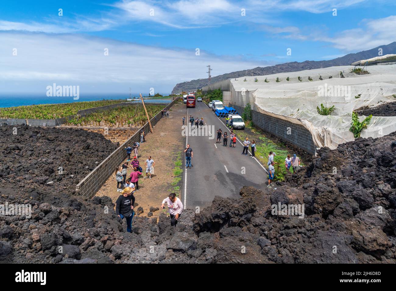 Destroyed road under the lava flow of the new volcano Tajogaite from ...