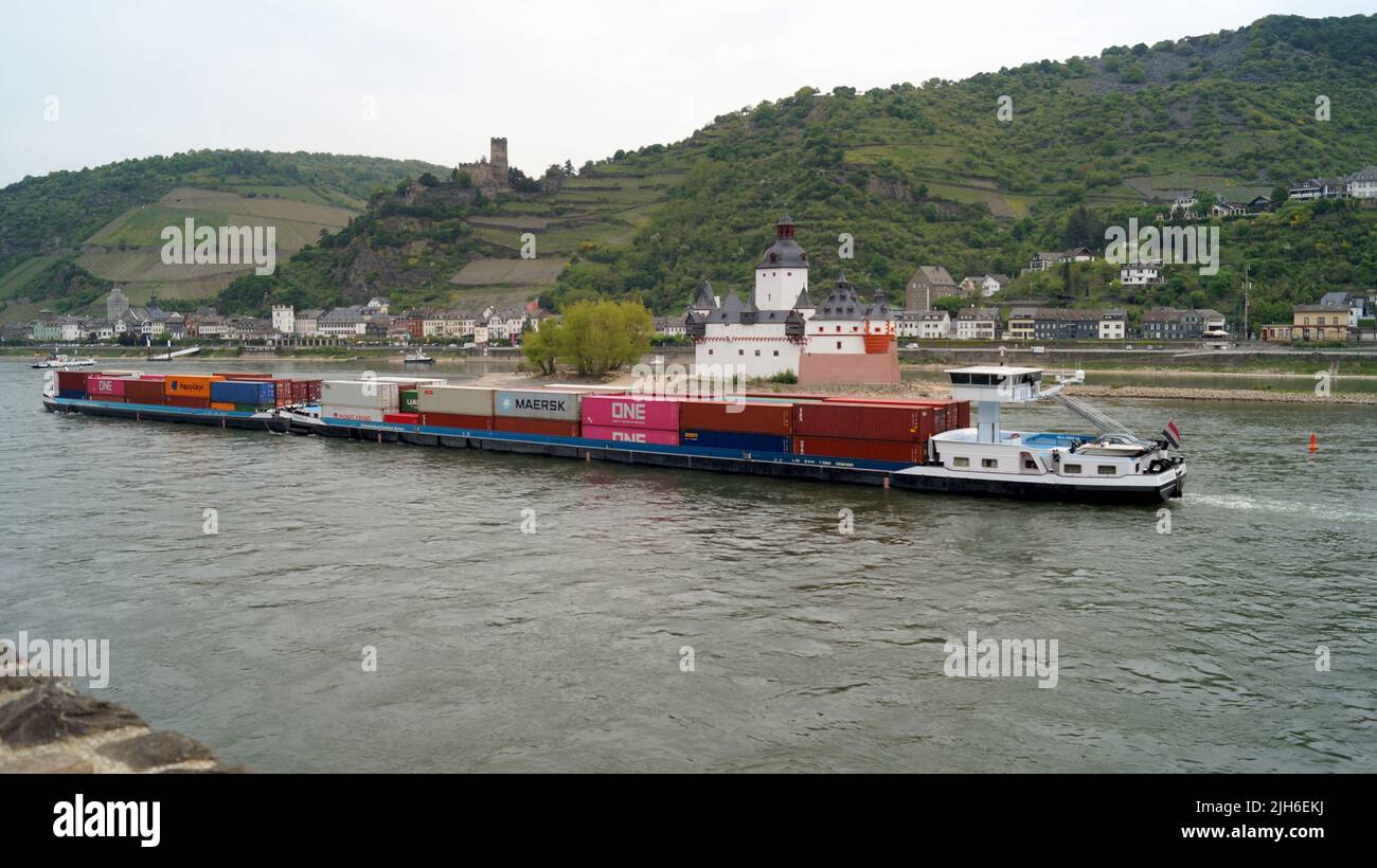 Containers laden barge passing down the River Rhine, Pfalzgrafenstein ...