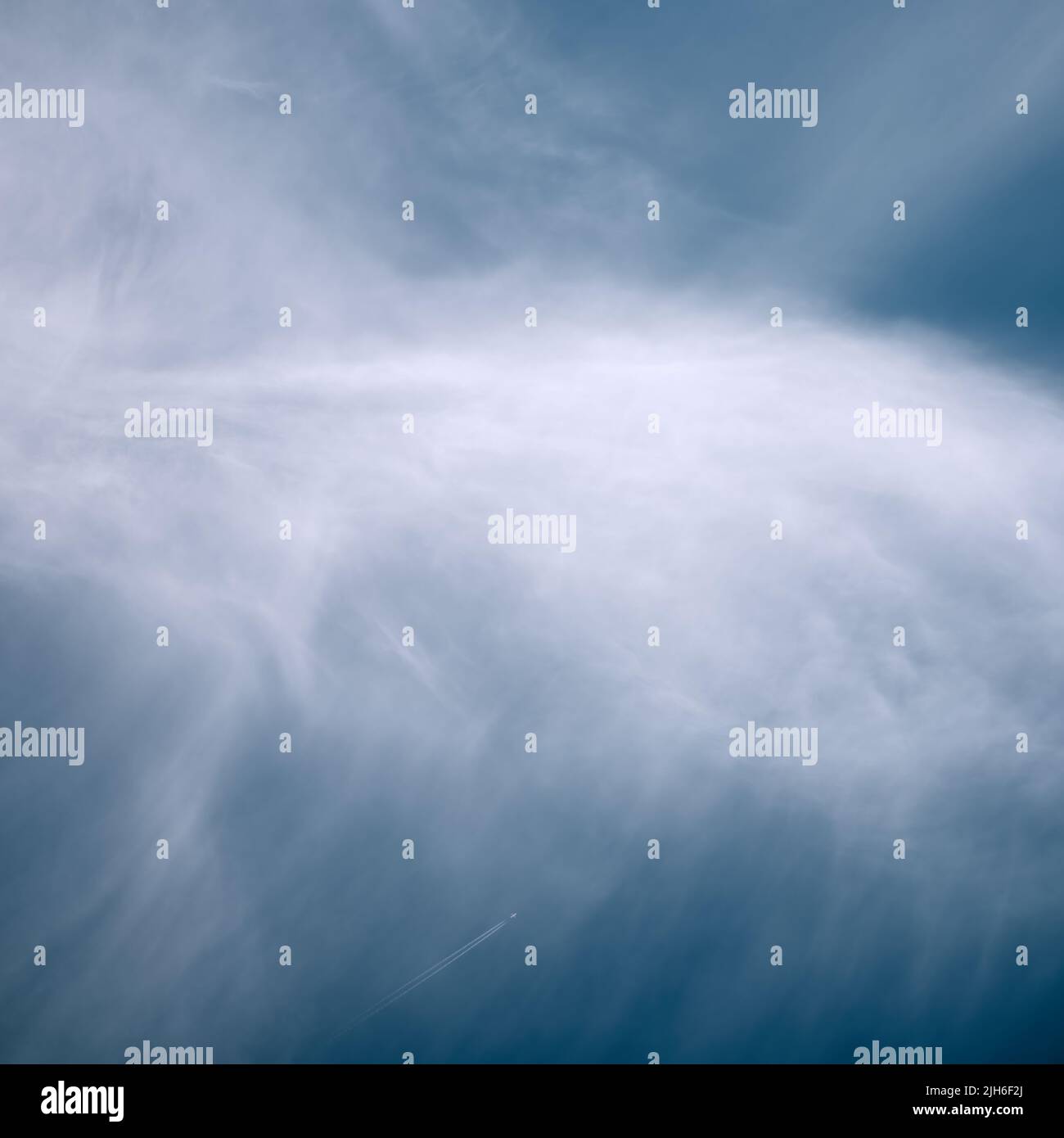 The plane flies in the sky full of clouds, background, texture Stock ...