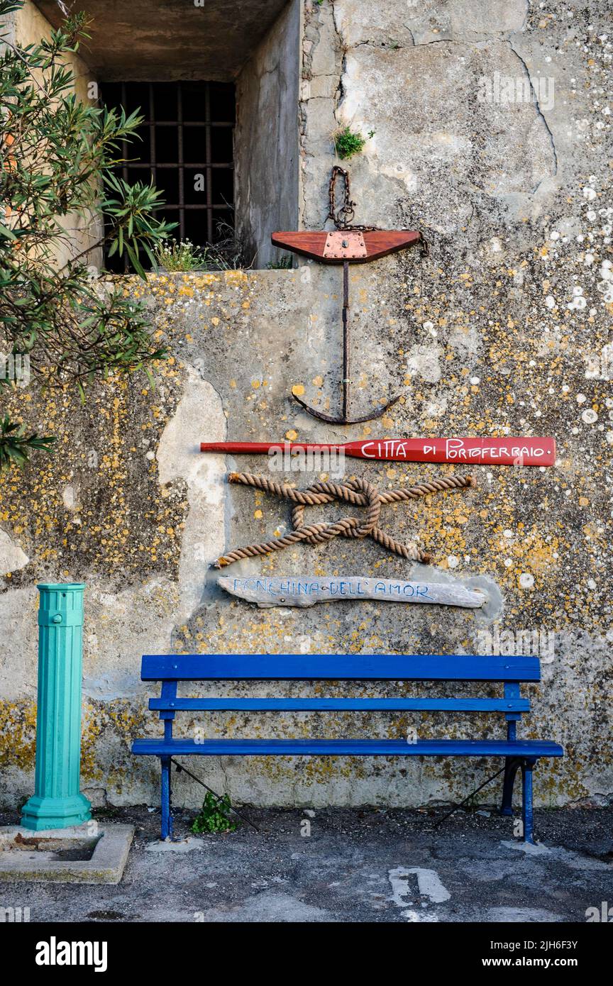 Wall decoration of nautical symbols on old house wall, small anchor ...