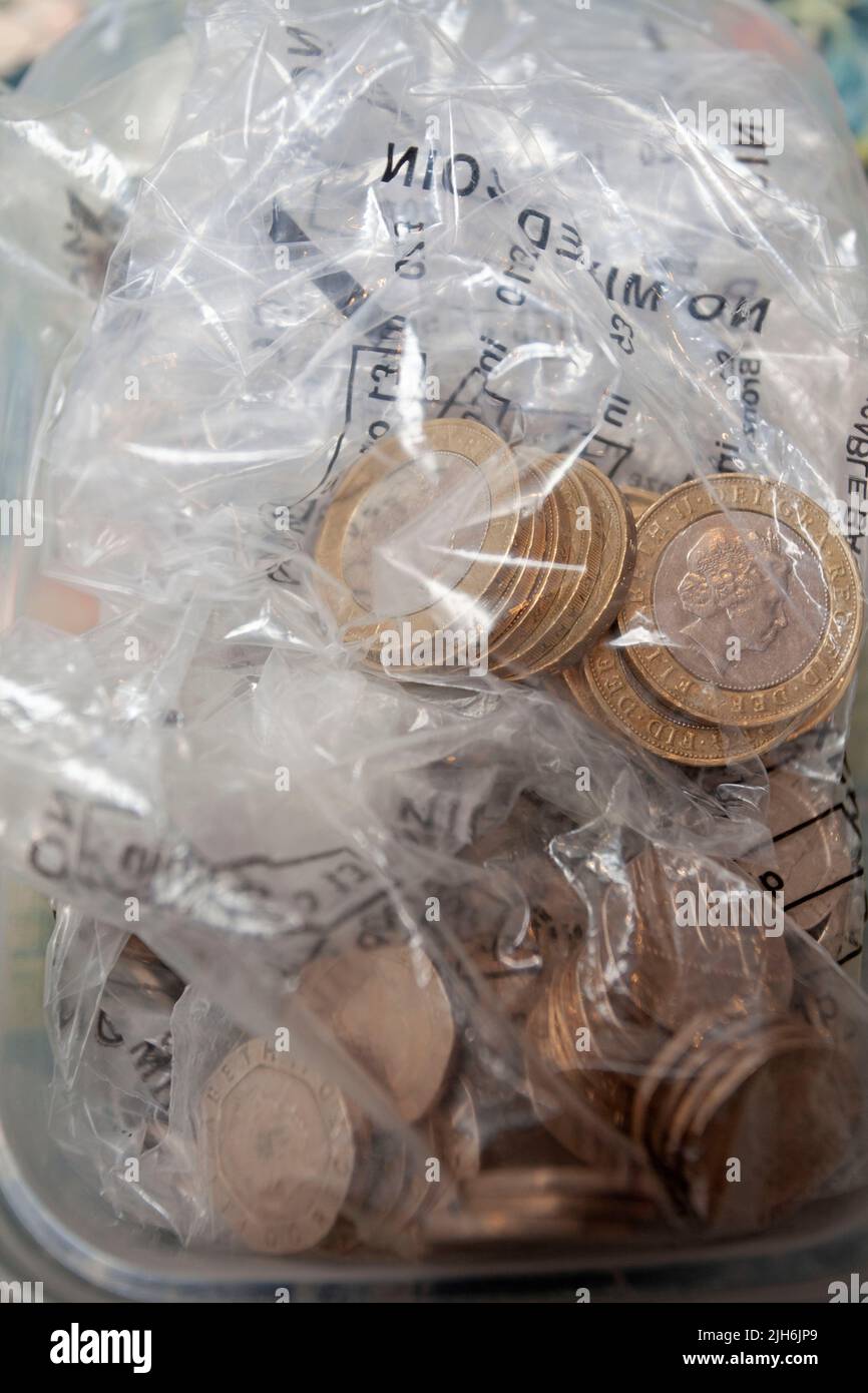 Bagged up one pound coins Stock Photo - Alamy