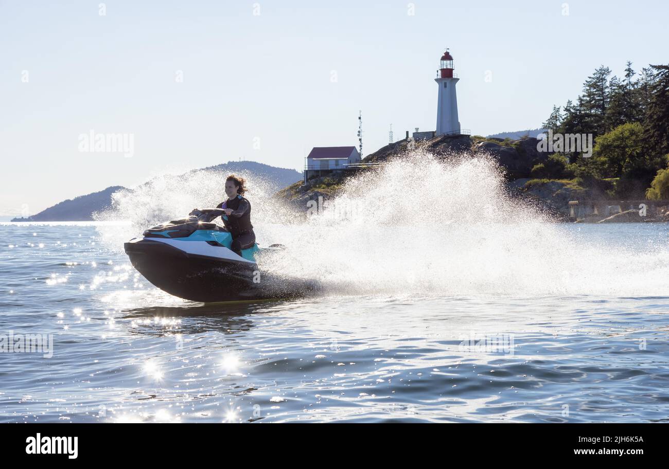 Adventurous Caucasian Woman on Sea-Doo riding in the Ocean Stock Photo ...
