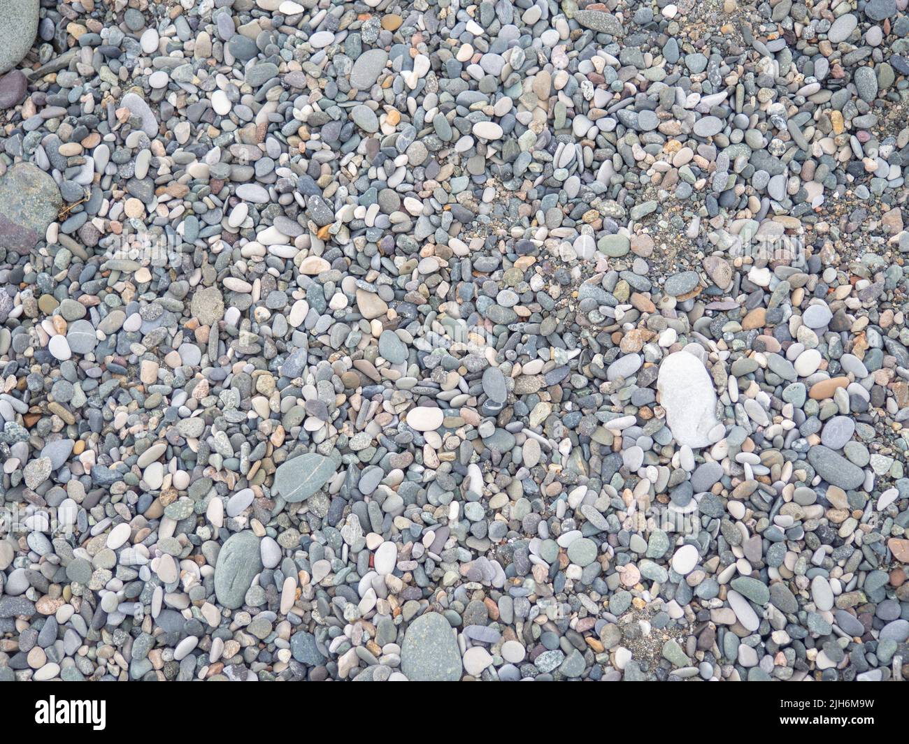 Big stones on the beach. Background from stones. Boulders on the ...